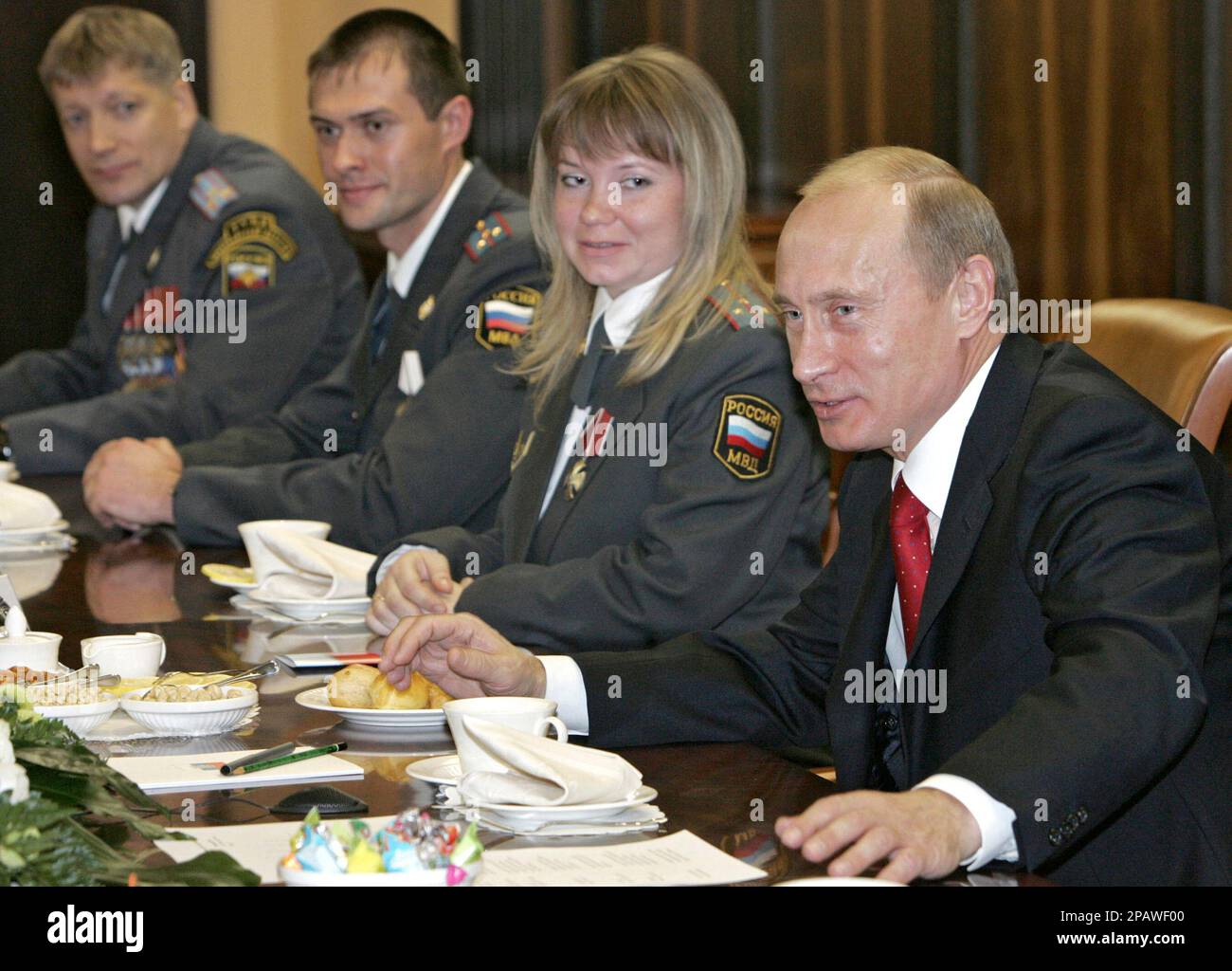 Russian President Vladimir Putin, right, drinking tea with police ...