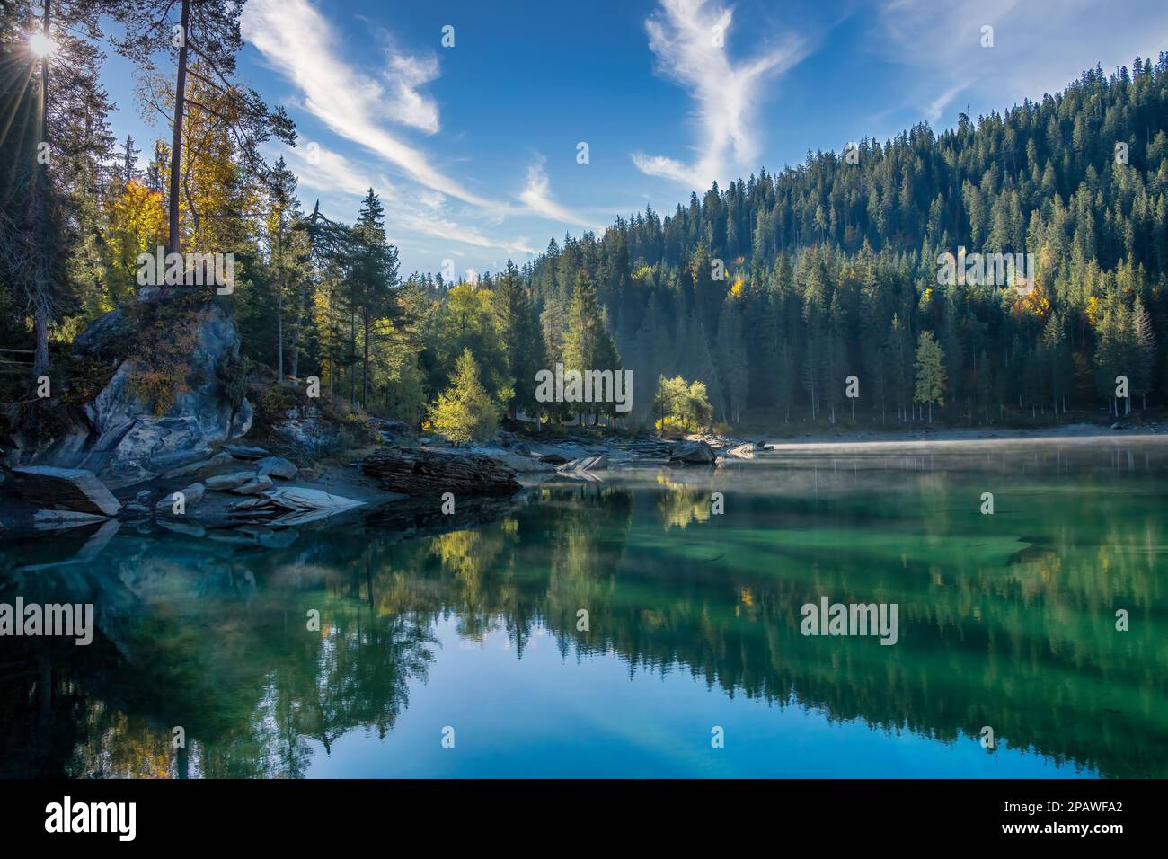 A mirror lake that reflects the forest in itself Stock Photo - Alamy