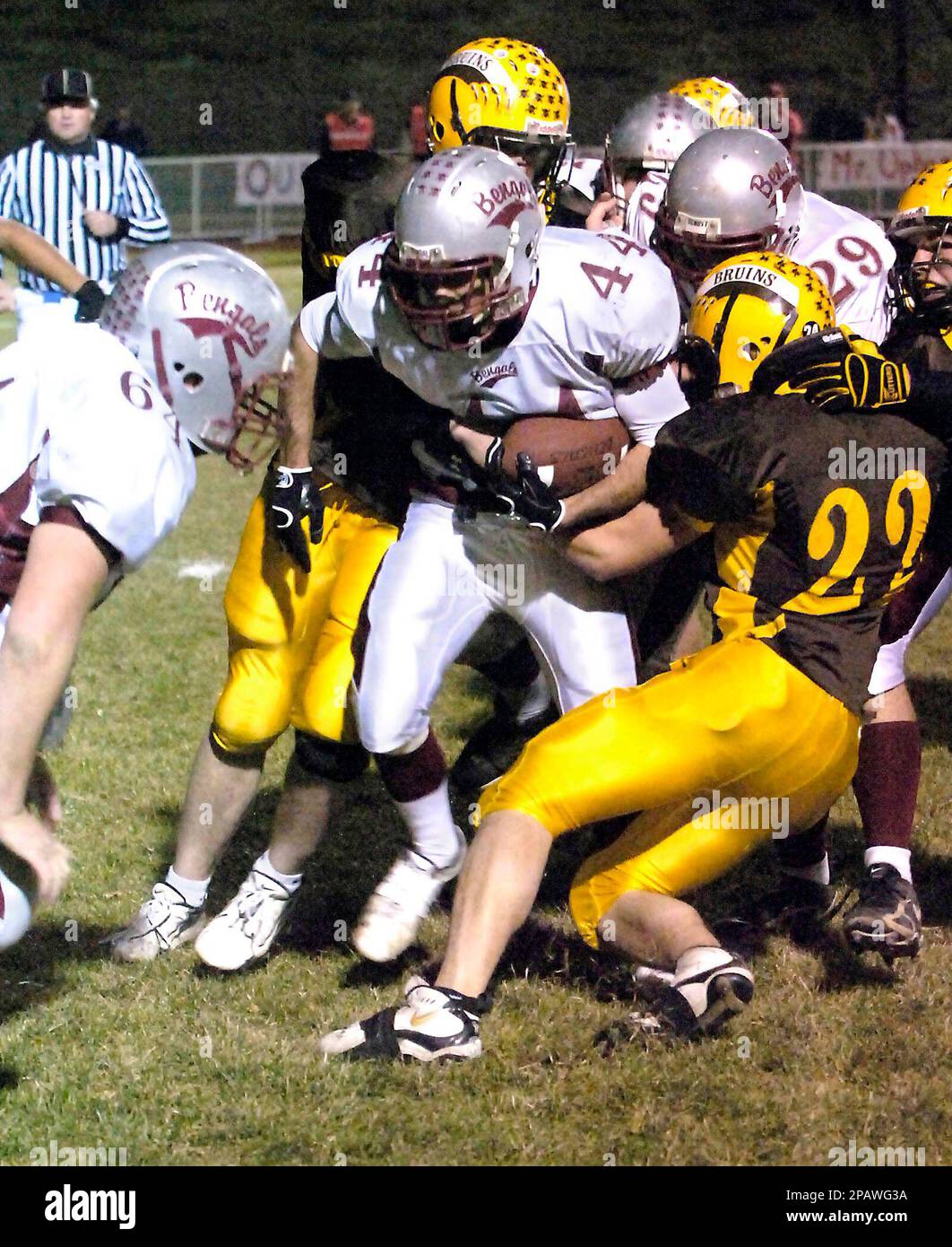 Helena High running back Nick Trapp, center, tries to break away from ...