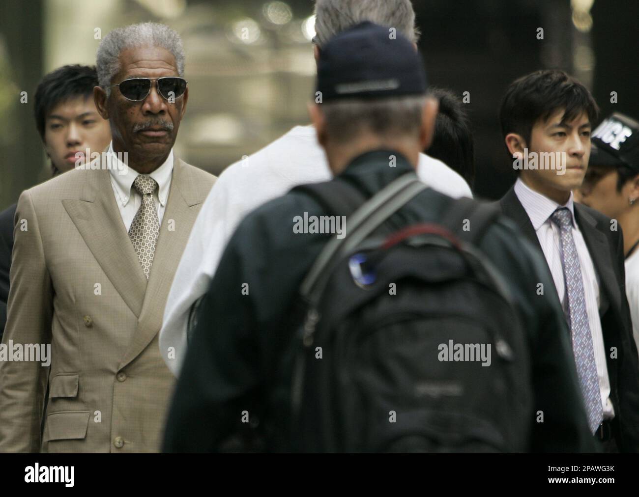 Actor Morgan Freeman, left, and Hong Kong actor Edison Chan, right, are ...
