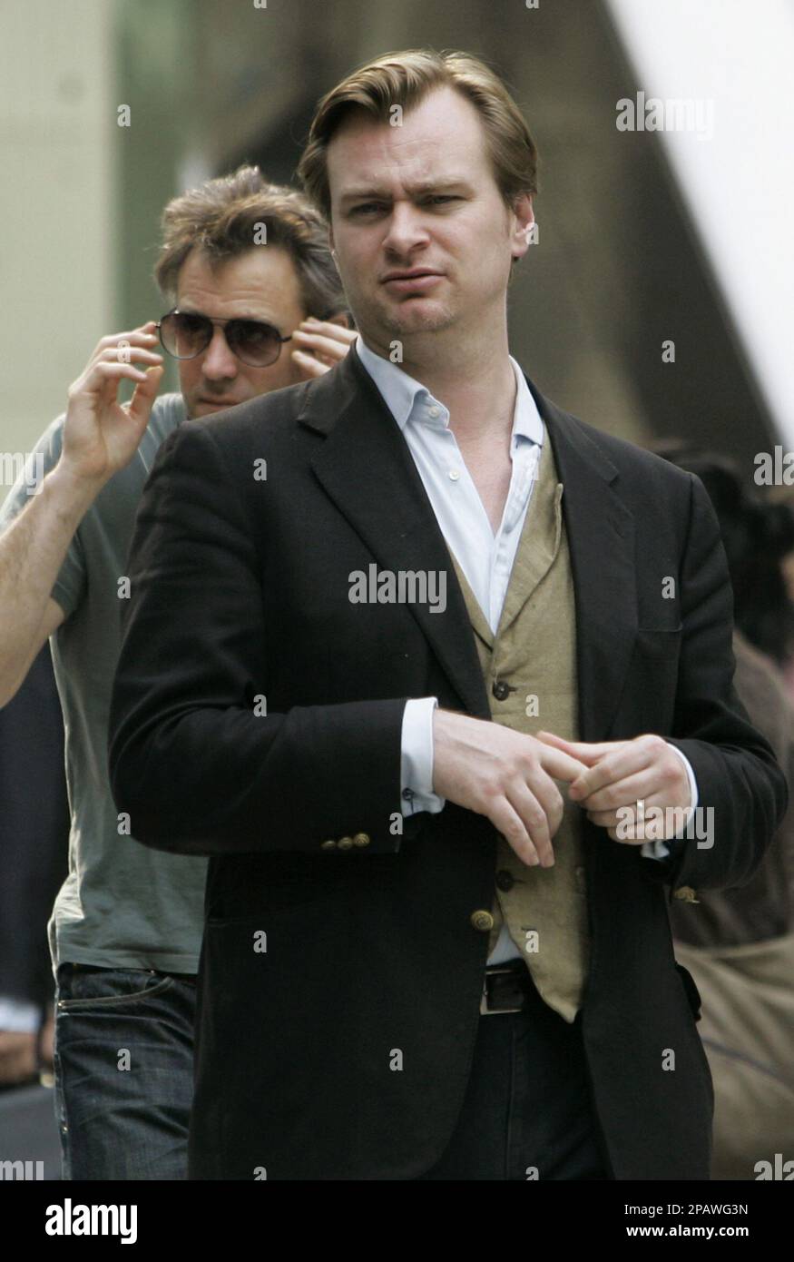 Director Christopher Nolan gestures during the filming of his latest ...