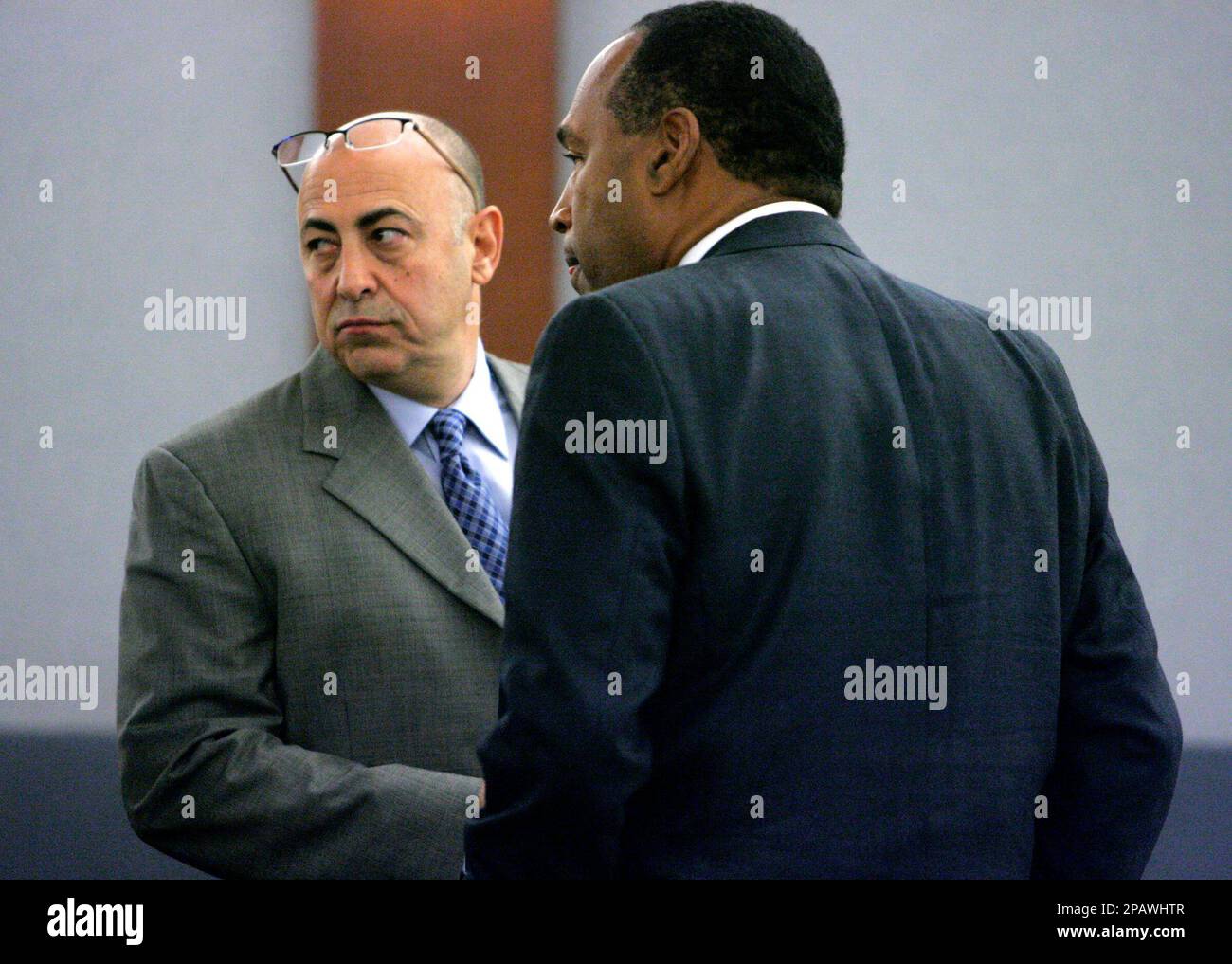 O.J. Simpson and Charles Ehrlich, left, one of two co-defendants, stand ...
