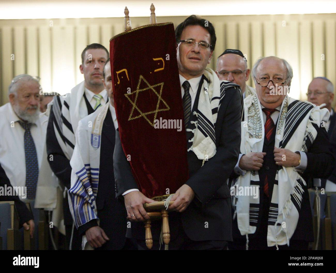 Members of the Jewish community carry a Torah into the Cologne, western ...