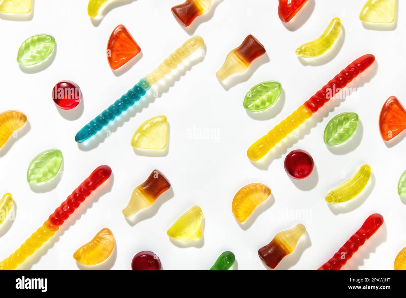 Chewing marmalade of different shapes, tastes and colors lie in a ...