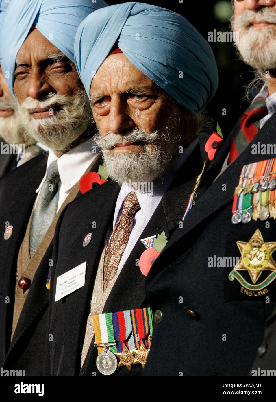 War veterans attend at a wreath laying ceremony in London, Friday, Nov ...