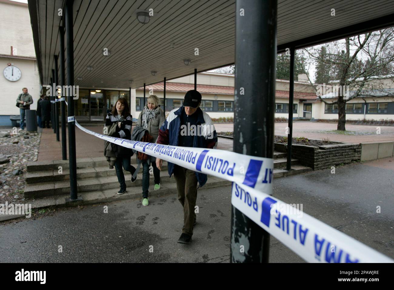 Two female students leave from the main entrance of Jokela High School ...