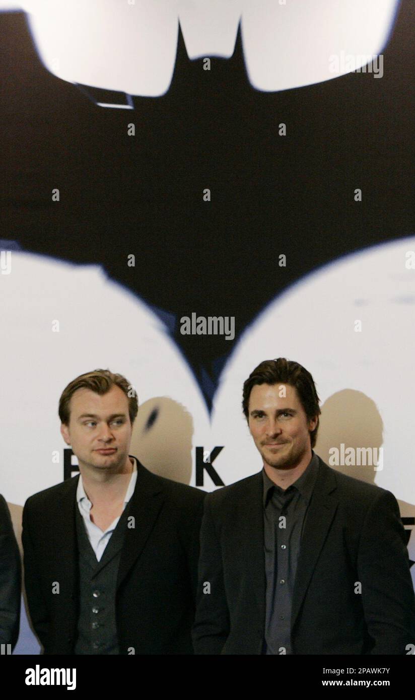 Actor Christian Bale, right, and director Christopher Nolan pose during ...