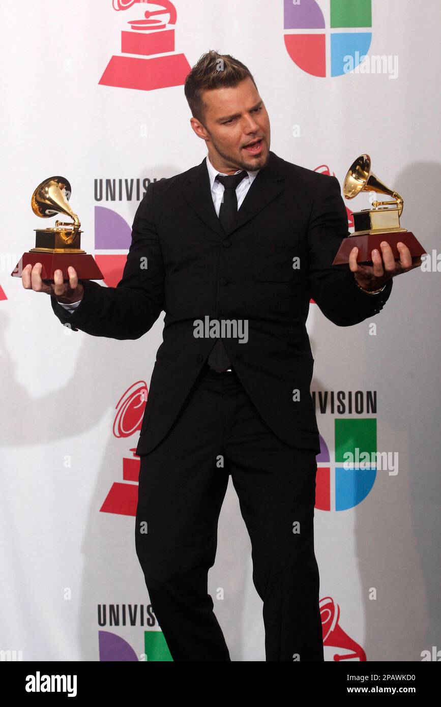 Ricky Martin poses with his Grammys for best male pop vocal album and ...