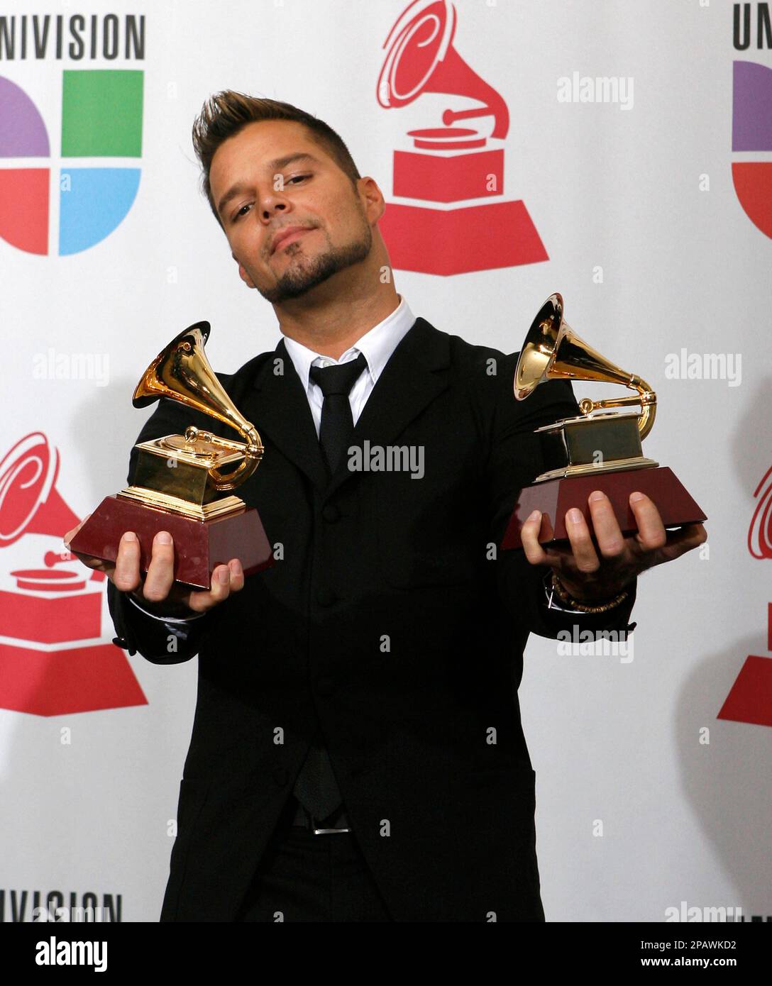 Ricky Martin poses with his Grammys for best male pop vocal album and ...