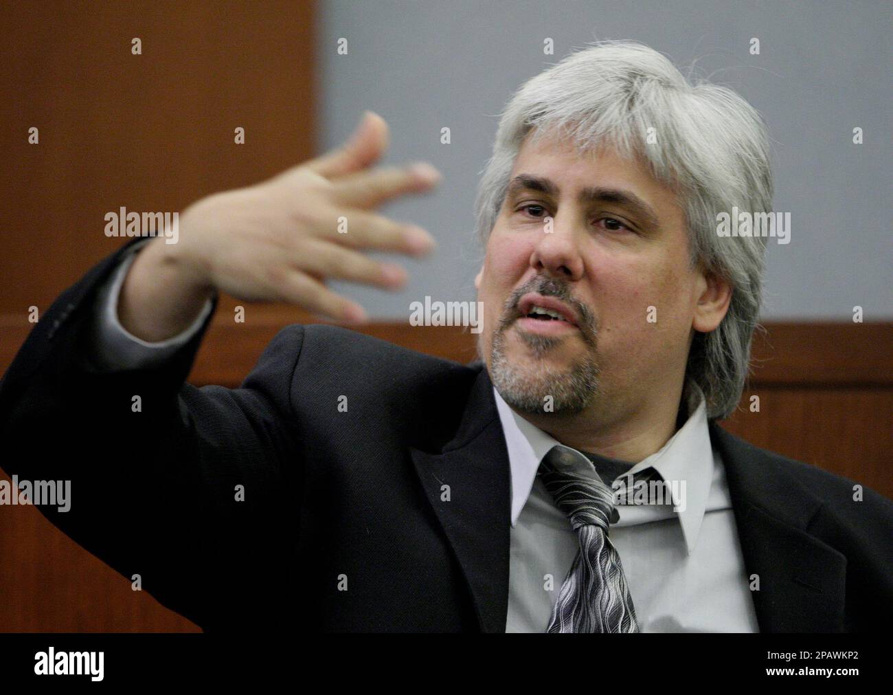 Tom Riccio testifies in a courtroom during O.J. Simpson's preliminary ...