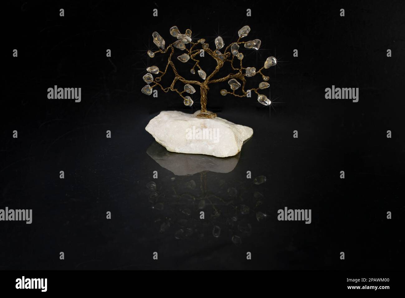 Copper wire tree on black background, close up with reflection Stock ...