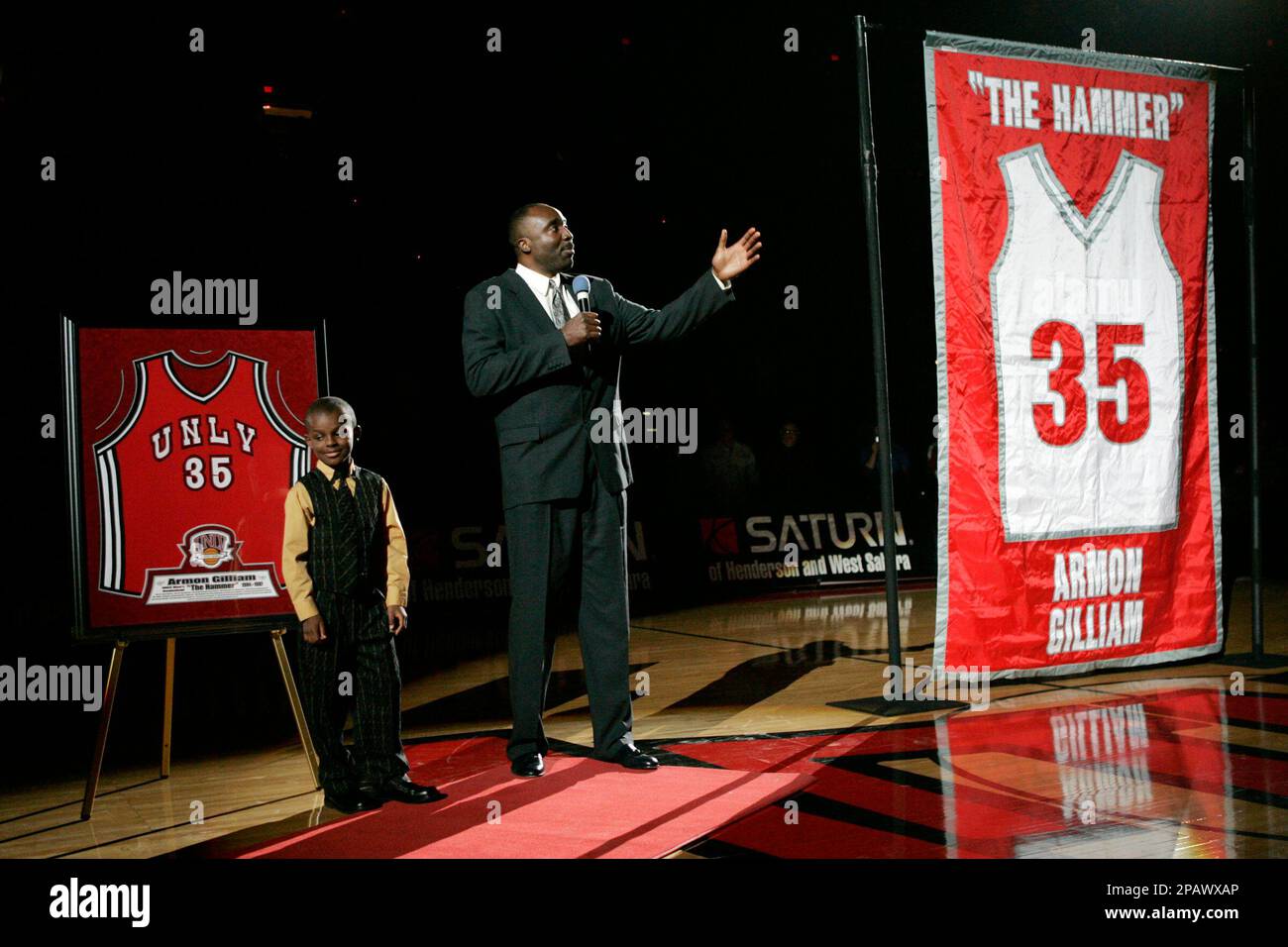 Armon Gilliam, center, a former UNLV and NBA player, speaks during his ...