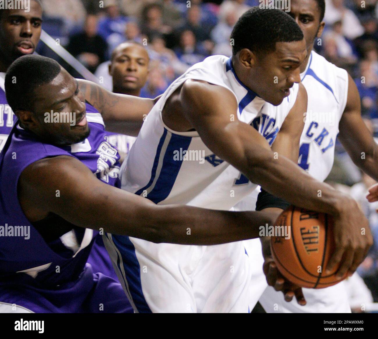 Central Arkansas' Brian Marks, left, tries to steal the basketball from ...