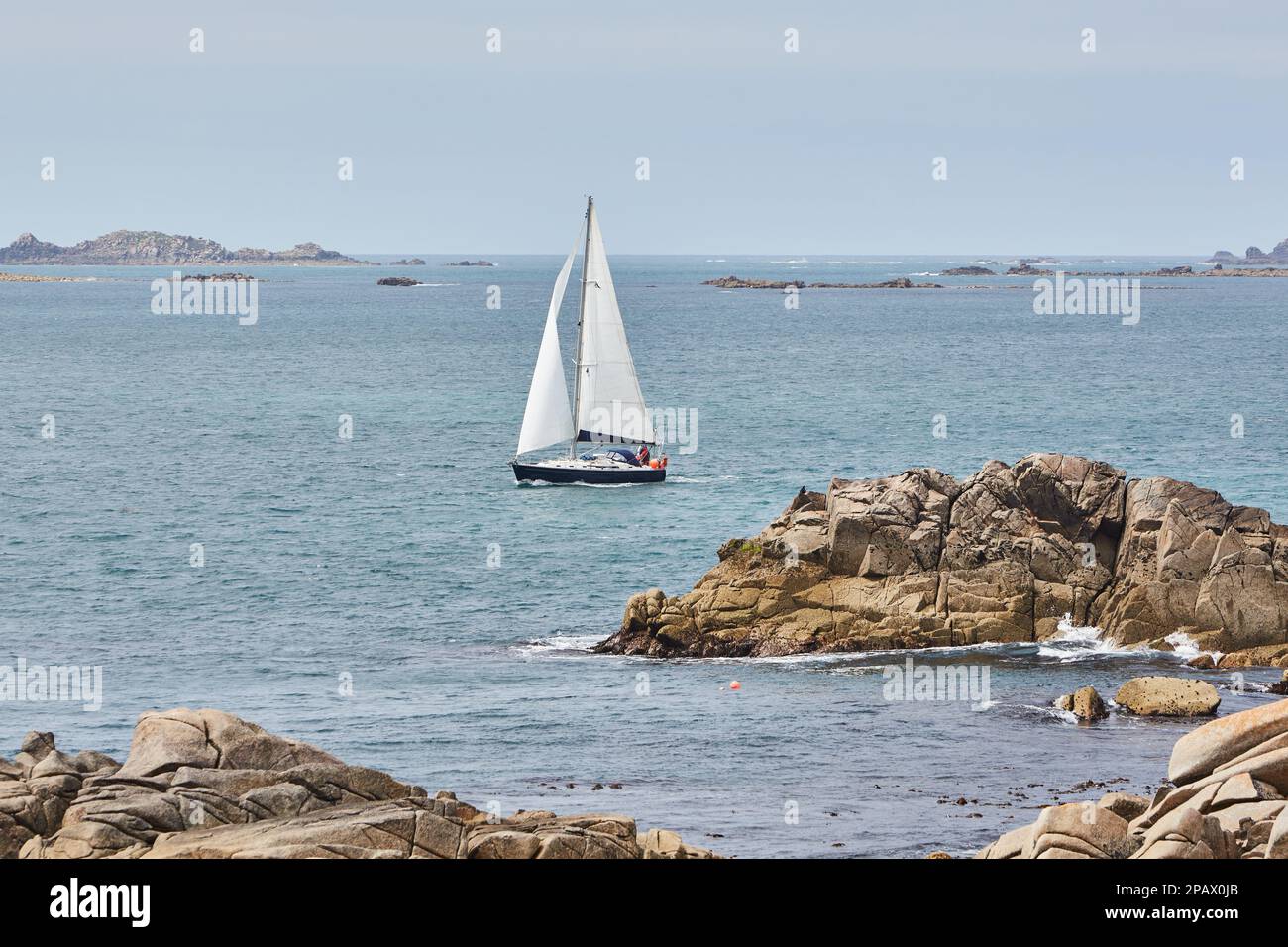 Isles of Scilly, United Kingdom - sailboat sailing between rocks. rocks ...