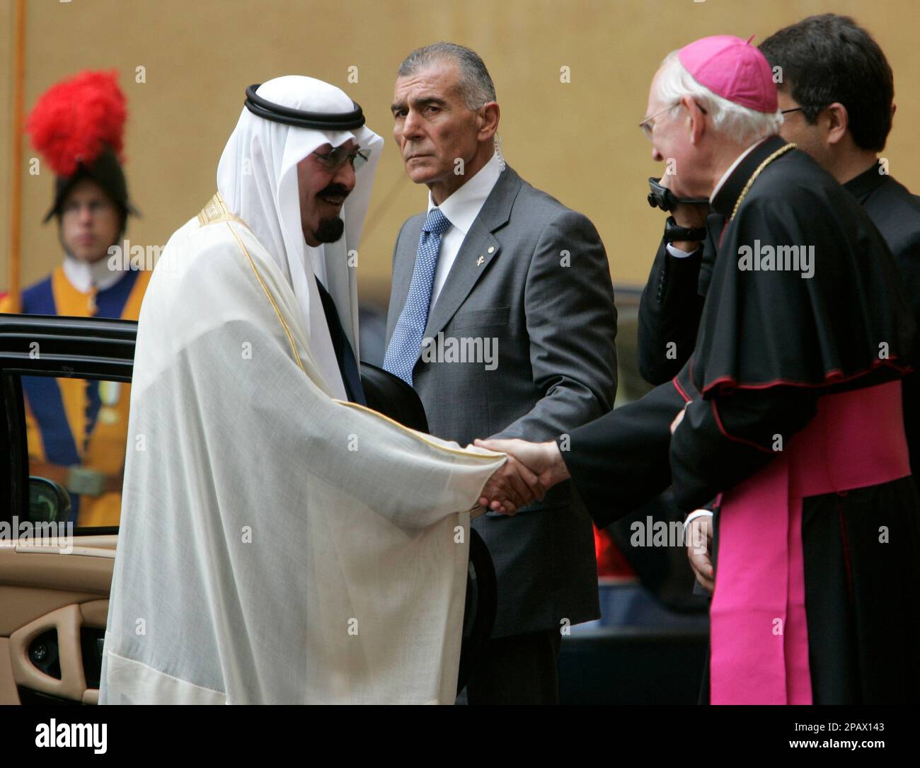 King Abdullah of Saudi Arabia is greeted by Archbishop James Harvey ...