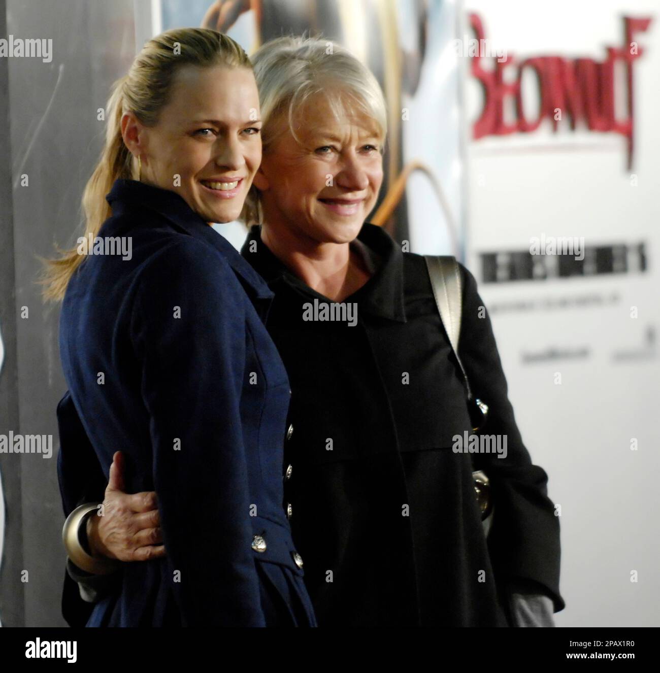 Robin Wright Penn left, a cast member of the film "Beowulf," poses with ...