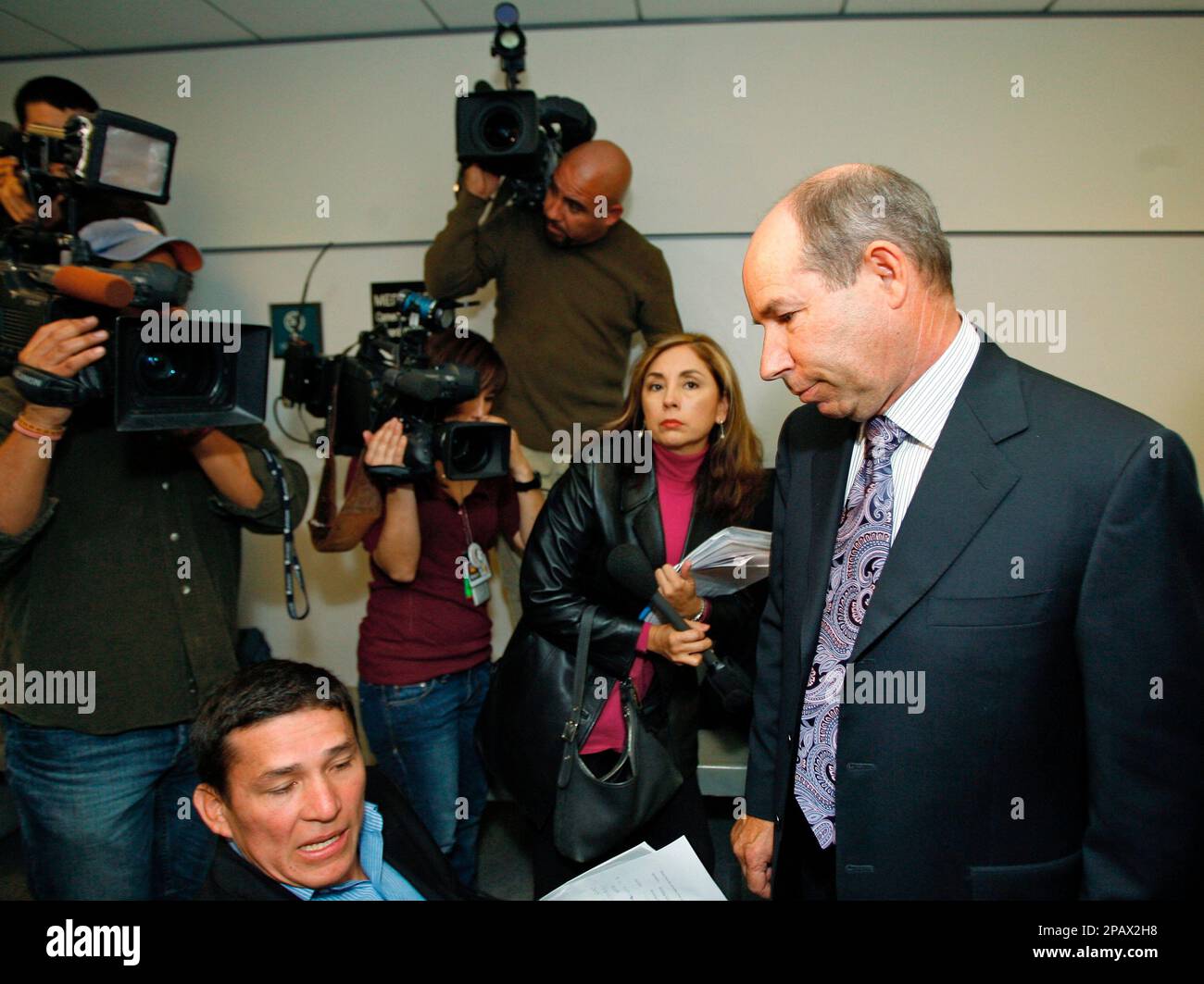 Attorney Duane Miller, right, who represents banana workers, declines ...