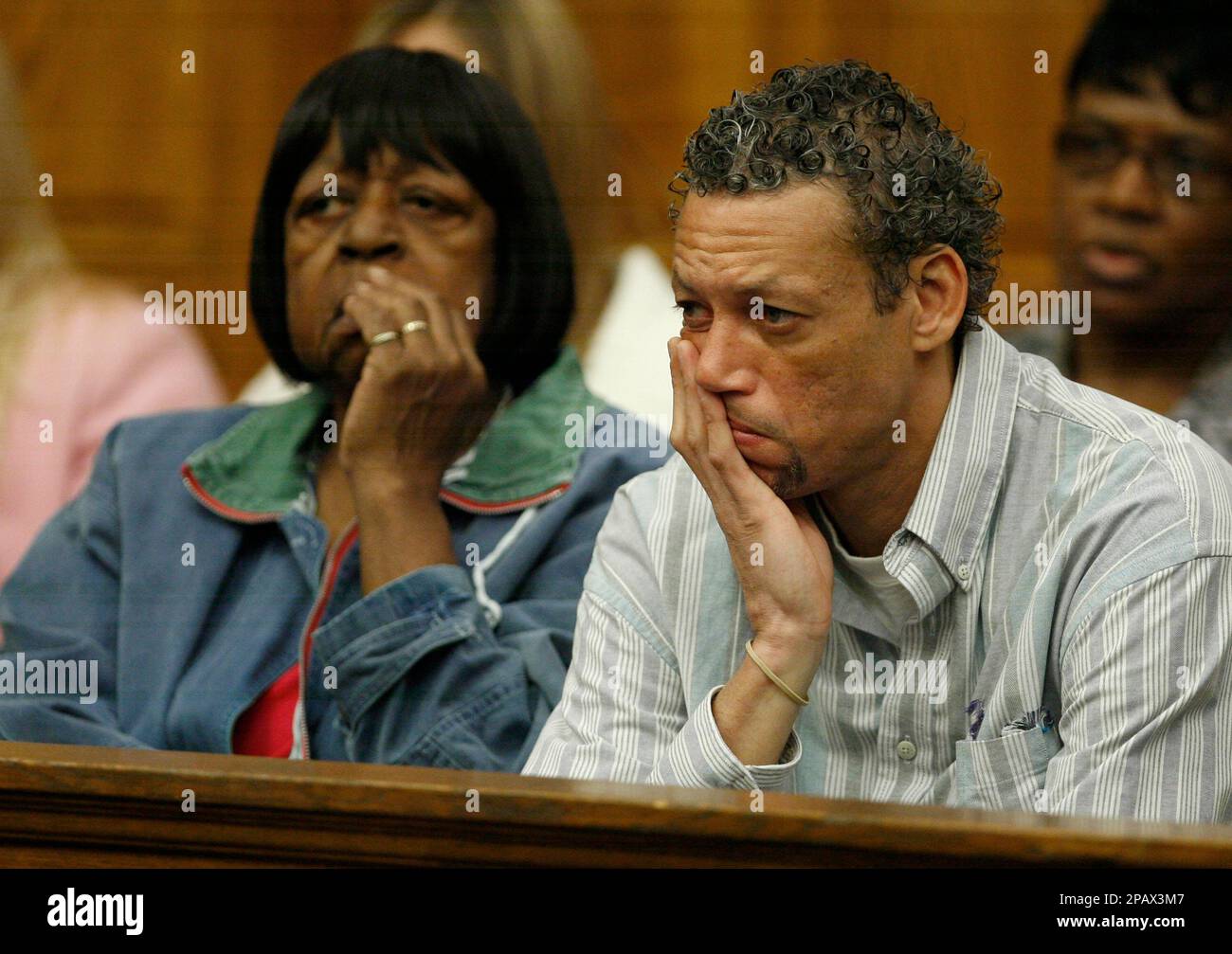 The mother and brother of Myisha Ferrell listen to the judge as he ...