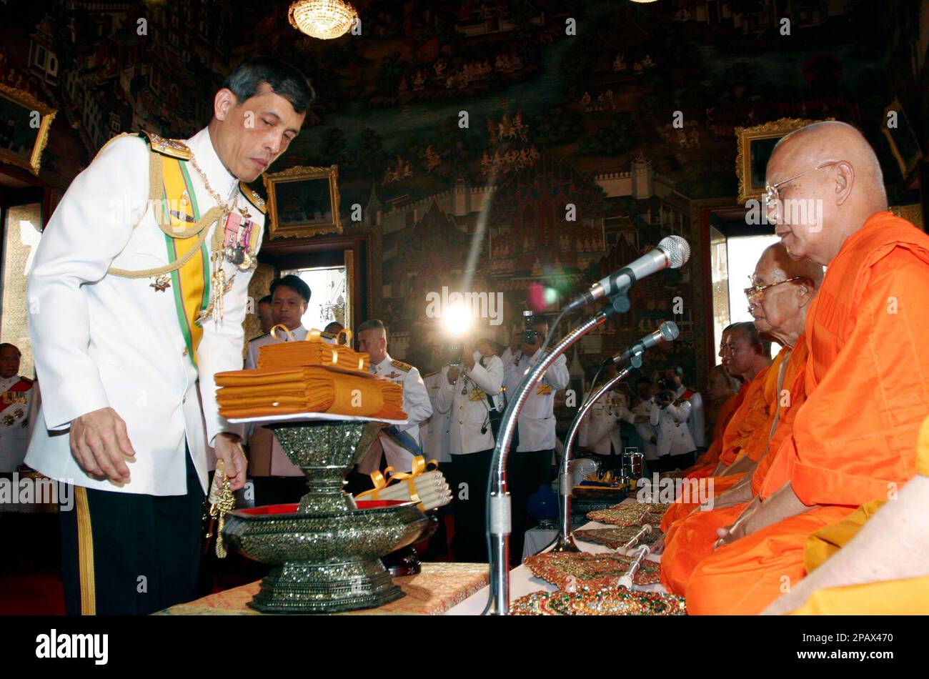 Thai Crown Prince Vajiralongkorn, left, offers saffron cloth to senior ...