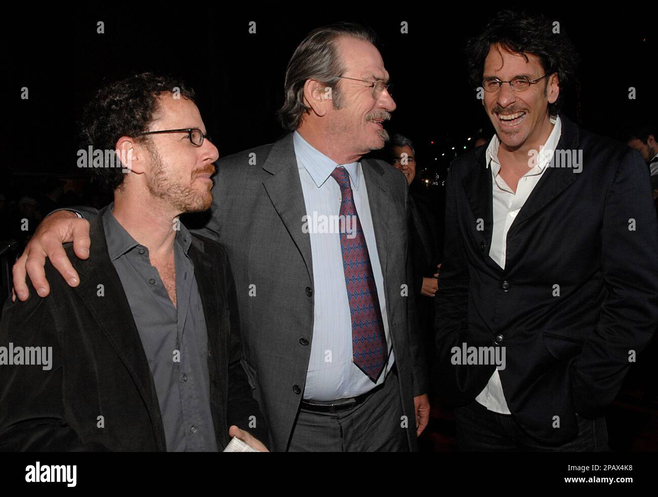 From left to right, writer Ethan Coen, actor Tommy Lee Jones, and ...