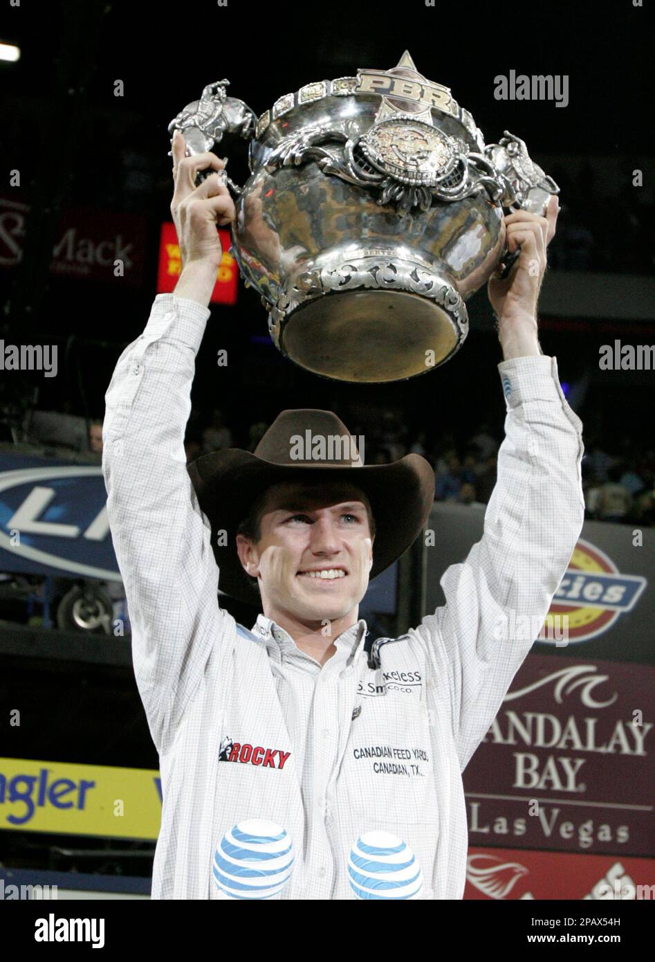 Justin McBride poses with the championship trophy during an award ...