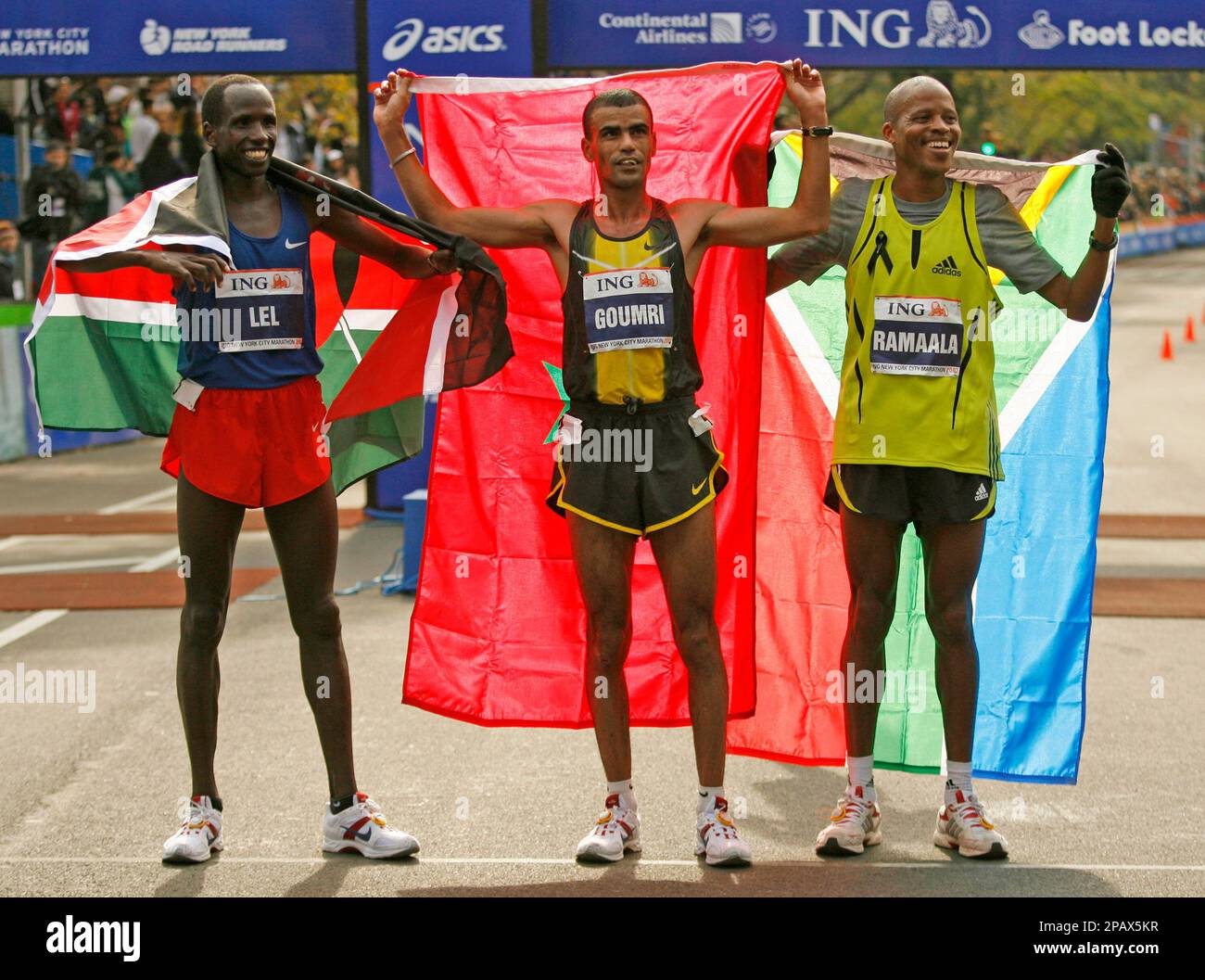 Men's marathon winner Martin Lel, left, of Kenya, Abdurrahim Goumri ...