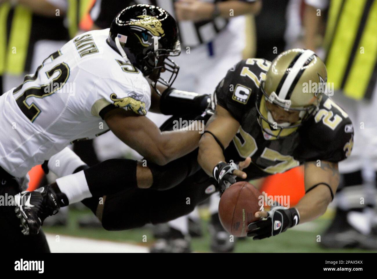 Jacksonville Jaguars linebacker Daryl Smith, left, knocks New Orleans ...