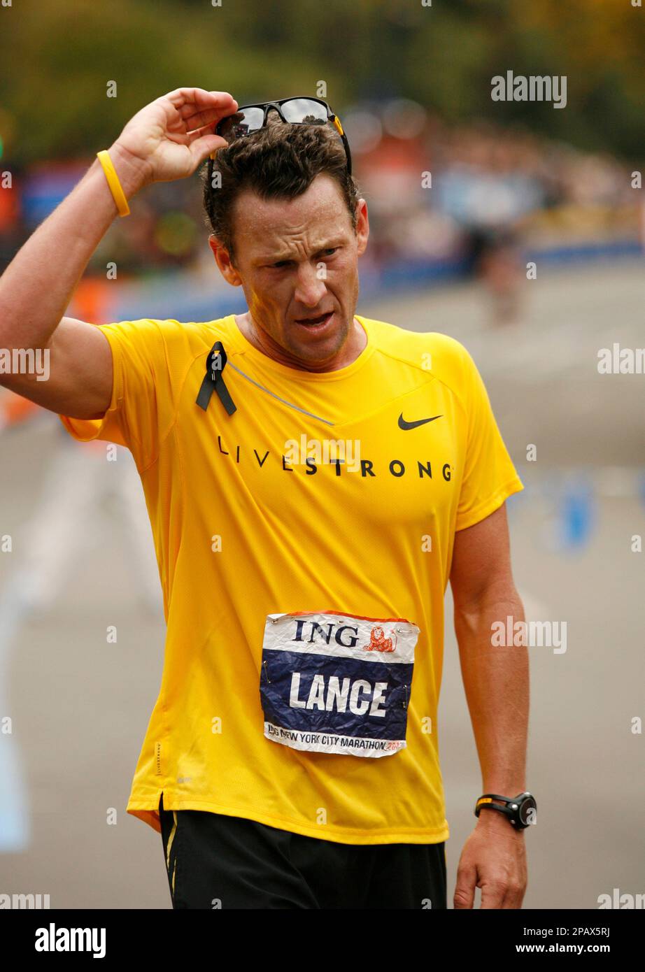 Lance Armstrong appears after crossing the finish line in the New York ...