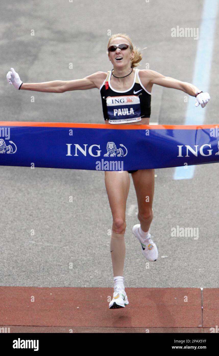 Paula Radcliffe, of Great Britain, places first in the women's division ...