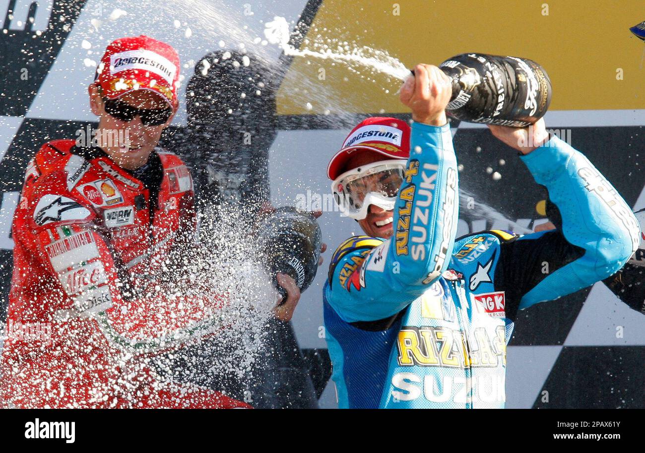 Rizla Suzuky rider John Hopkins of the U.S Team, right, celebrates next ...