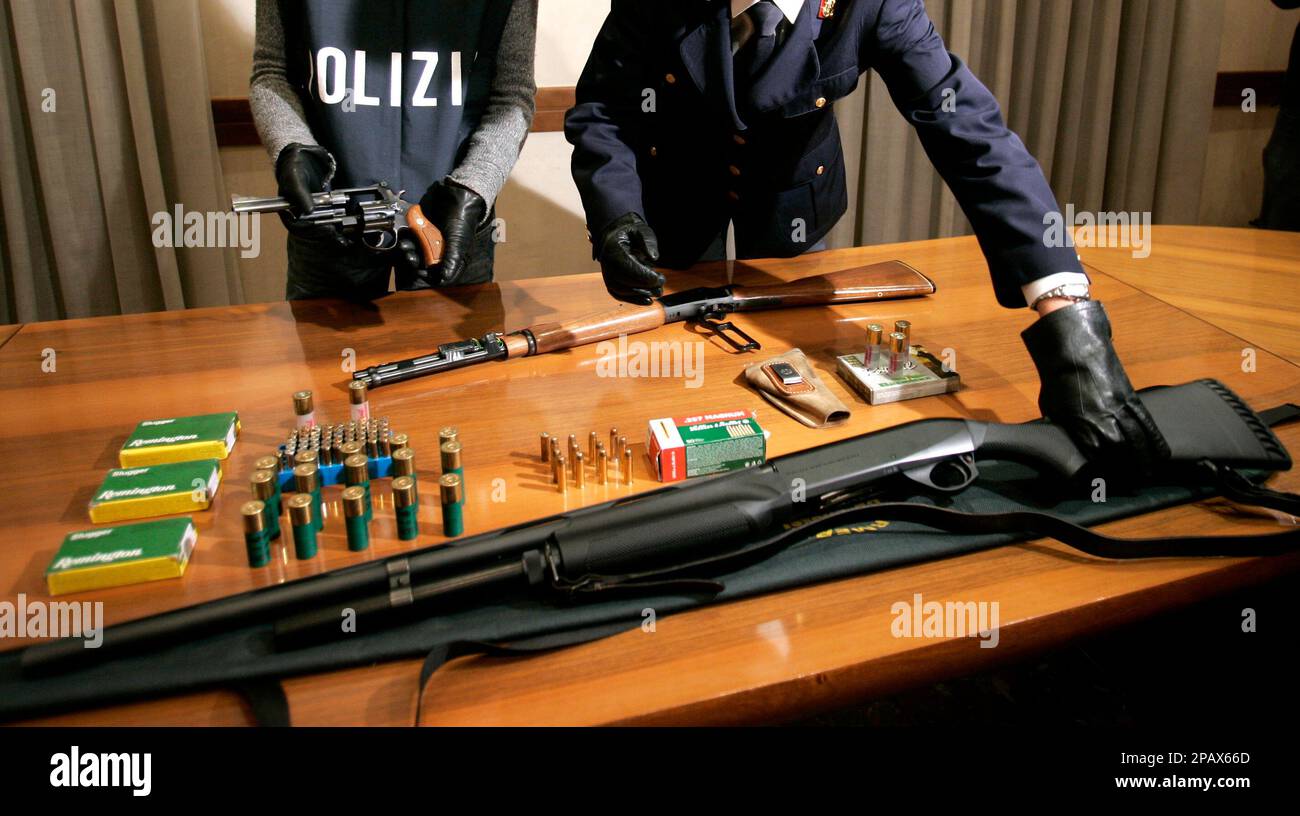 Italian police officers display to journalists, during a press ...