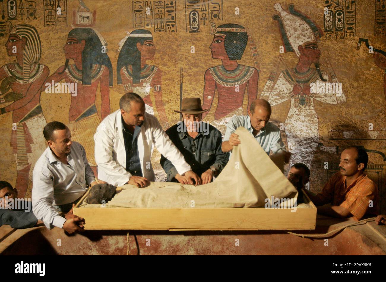 Egypt's antiquities chief Dr. Zahi Hawass, center, supervises the ...