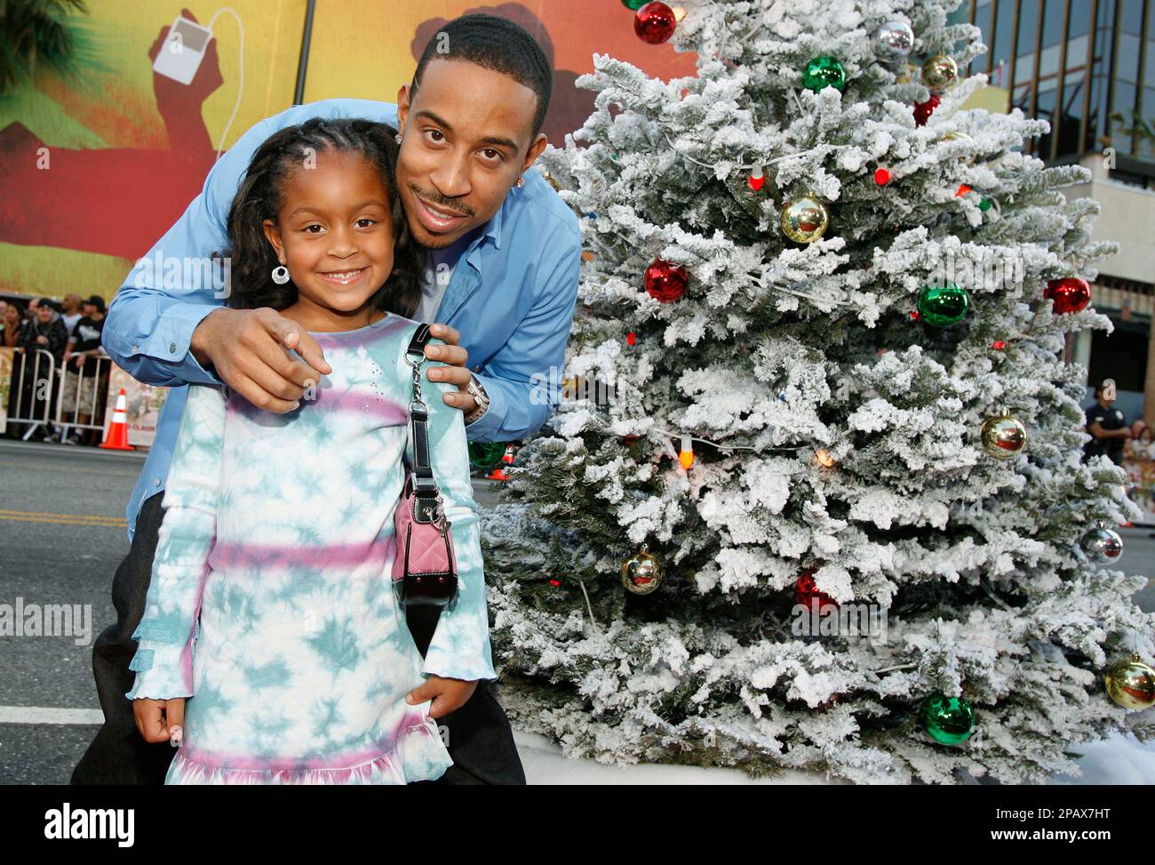 Ludacris, top, and his daughter, Karma Bridges, arrive at the premiere ...