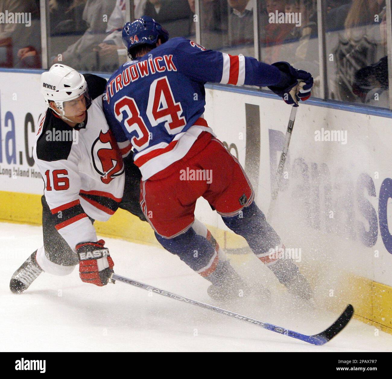 New York Rangers defenseman Jason Strudwick, right, battles for the ...