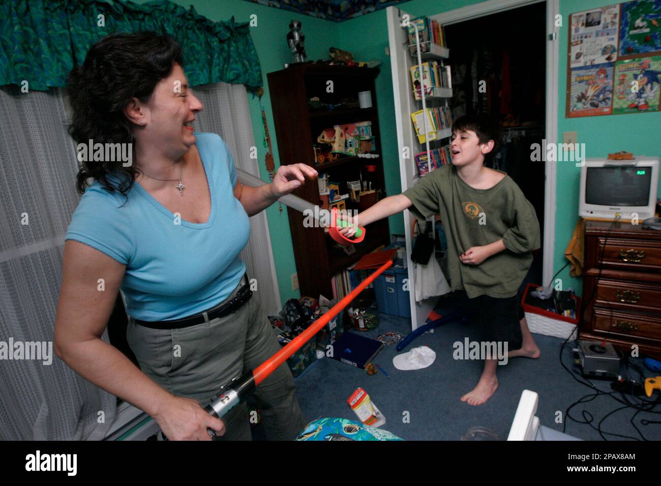 Julia Massey and son Ryan Massey, 11, right, share in a fun moment ...