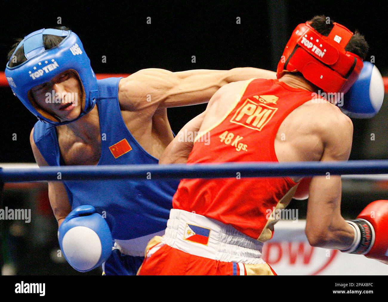 Harry Tanamor, right, of the Philippines, and Shiming Zou, of China ...