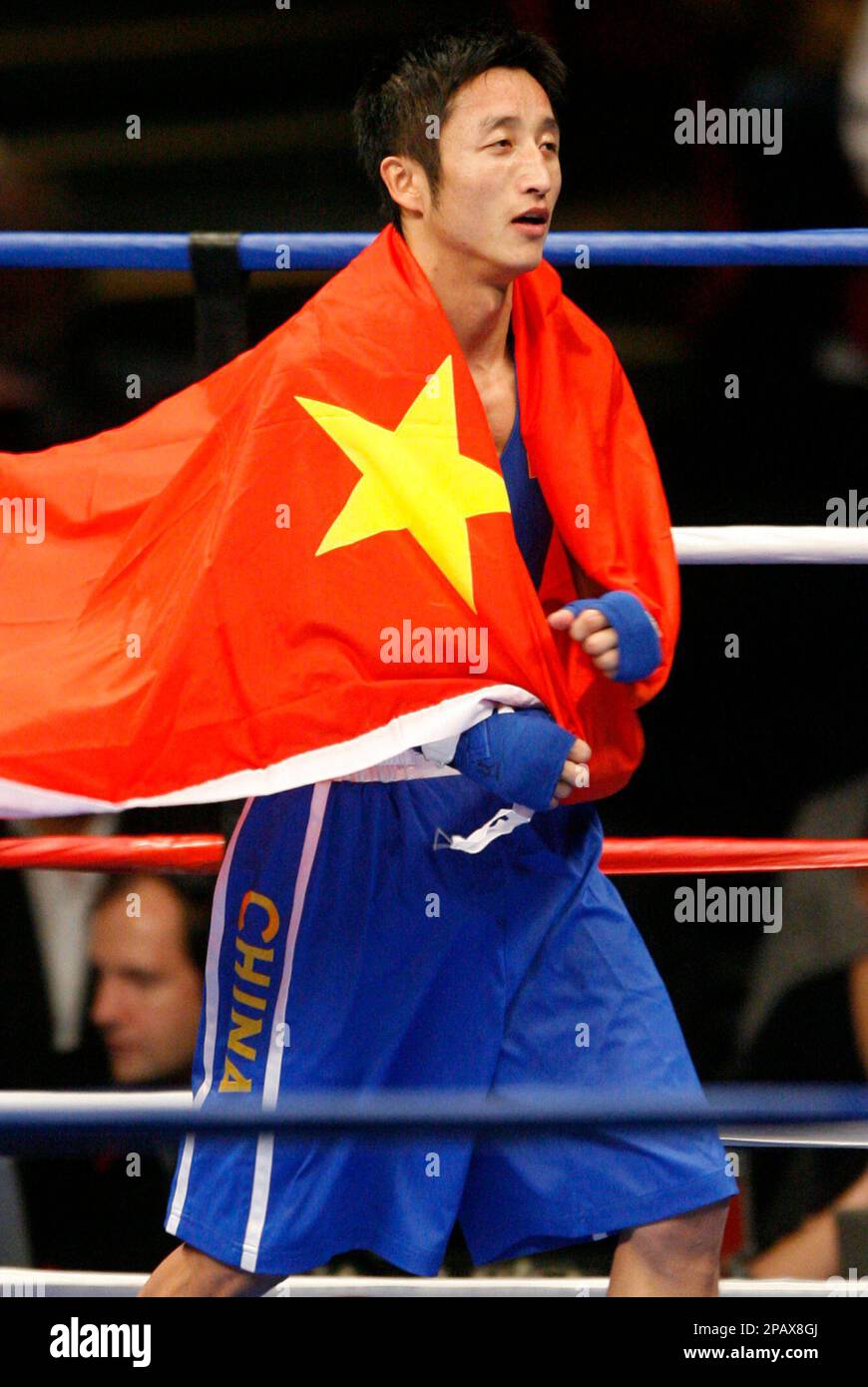 Shiming Zou of China, celebrates after he beat Harry Tanamor of the ...