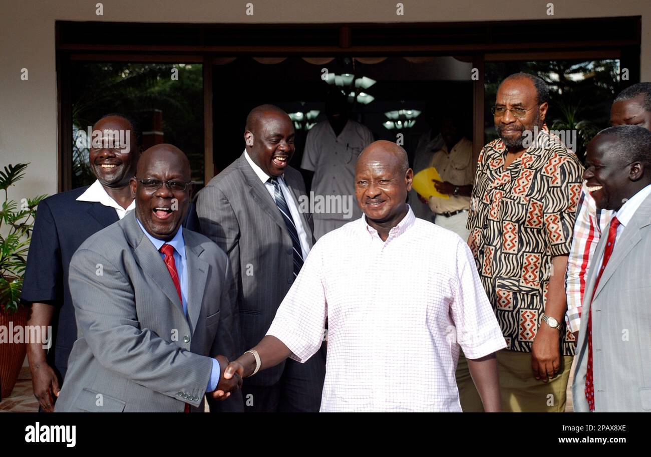 Uganda President Yoweri Museveni, center in white shirt, greets Lords ...