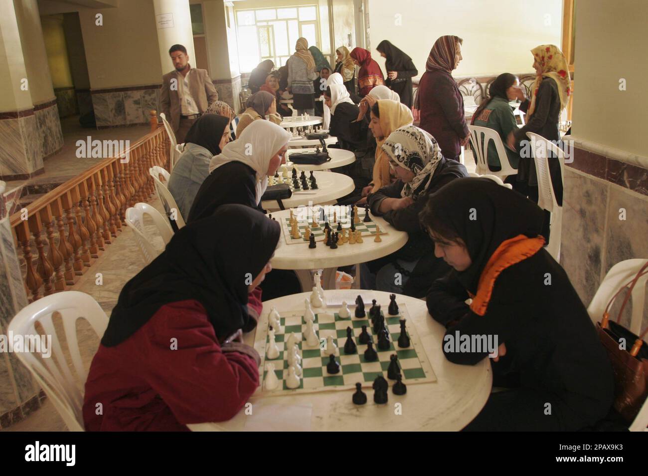 Afghan high school girls play chess during a tournament in Herat ...