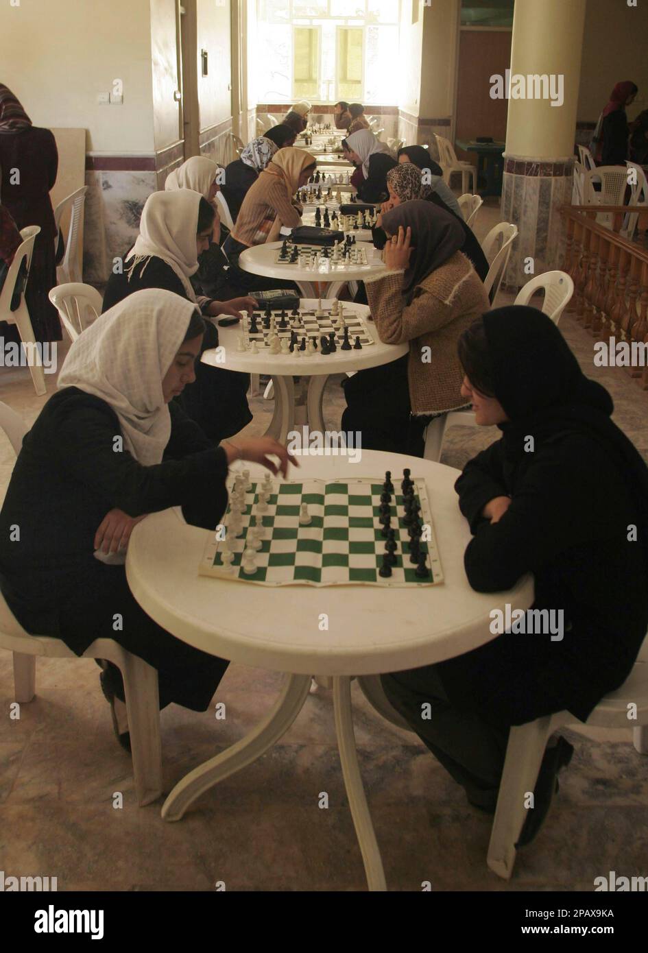 Afghan high school girls play chess during a tournament in Herat ...