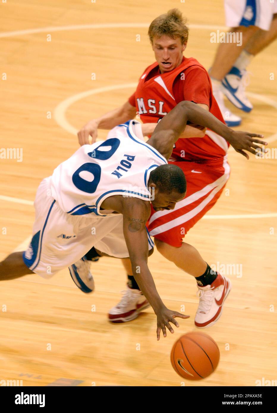 Saint Louis' Dwayne Polk (00) falls to the floor while trying to ...