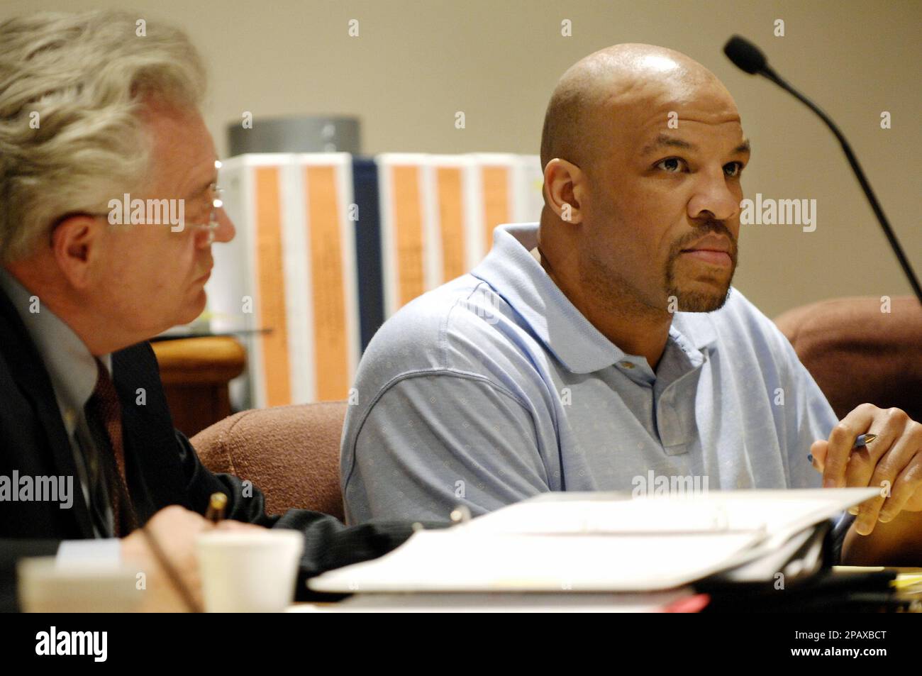 Moe Gibbs, right, listens as the prosecution calls witnesses during his ...