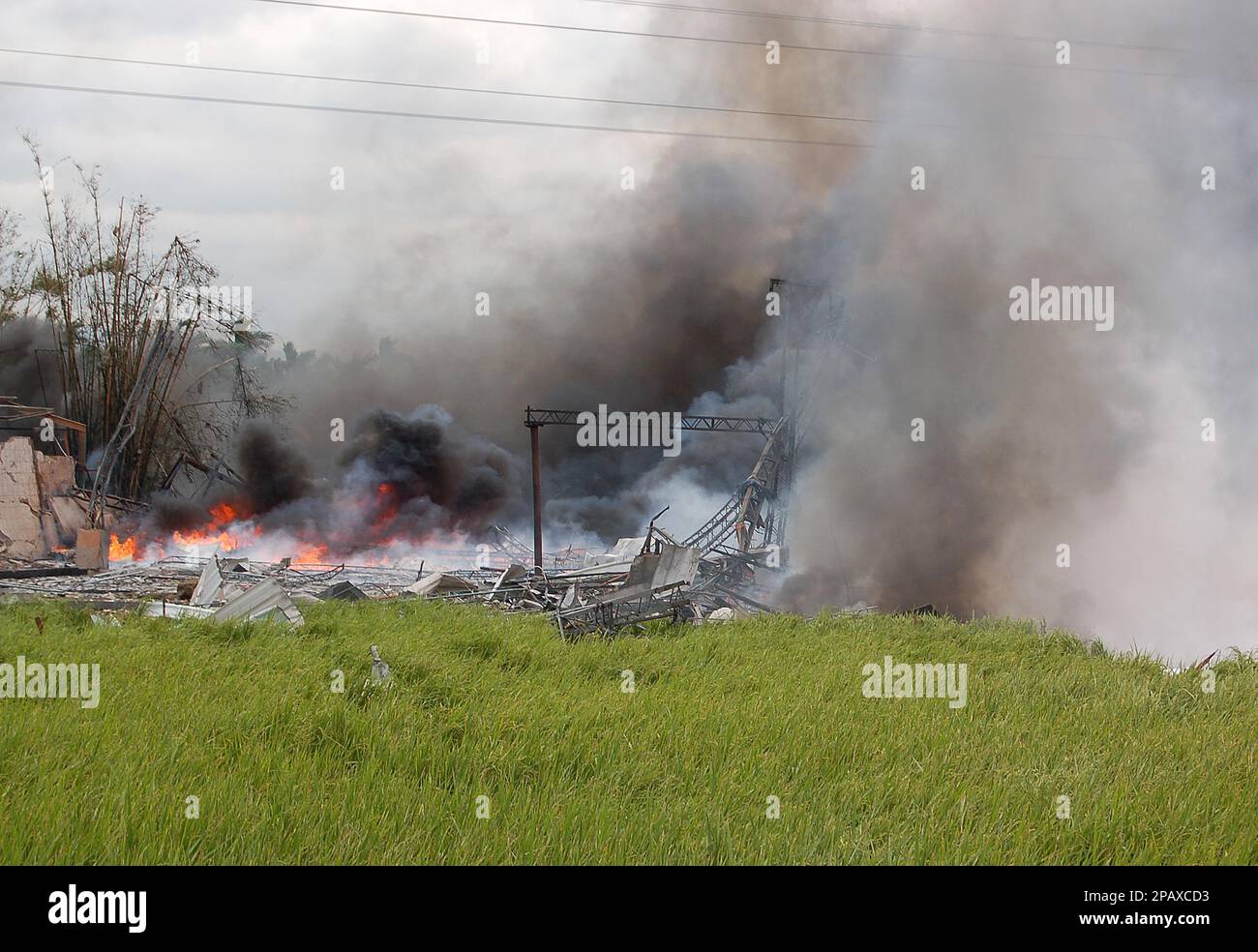 Smoke billows from a fire after an explosion at a factory in Miaoli ...