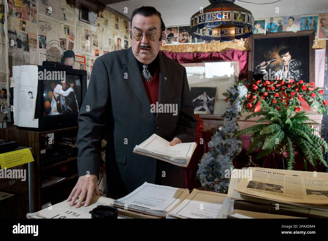 Bill Beeny looks over FBI files on Elvis Presley at the Elvis is Alive ...