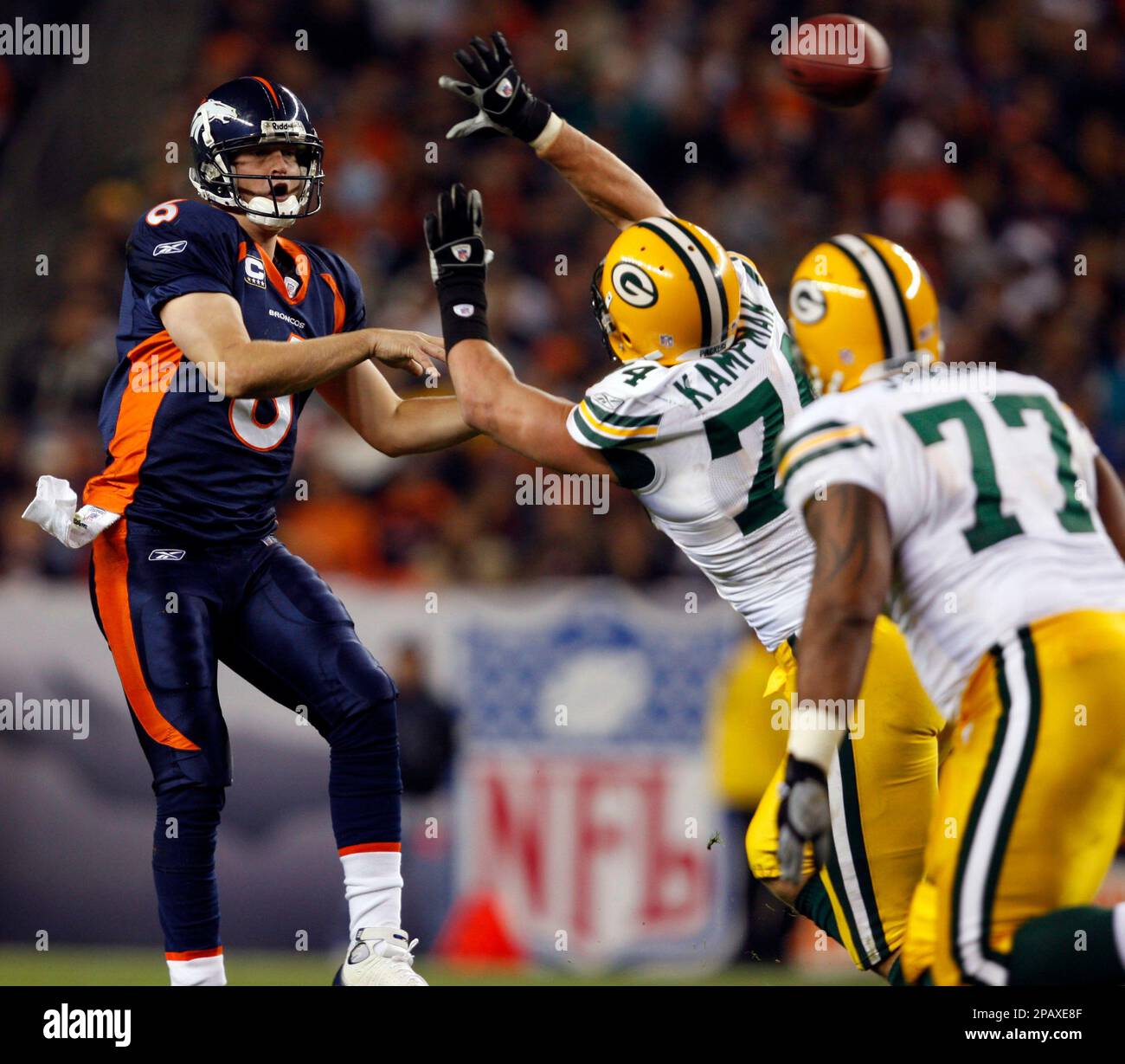 Green Bay Packers linemen Aaron Kampman, center, and Cullen Jenkins ...