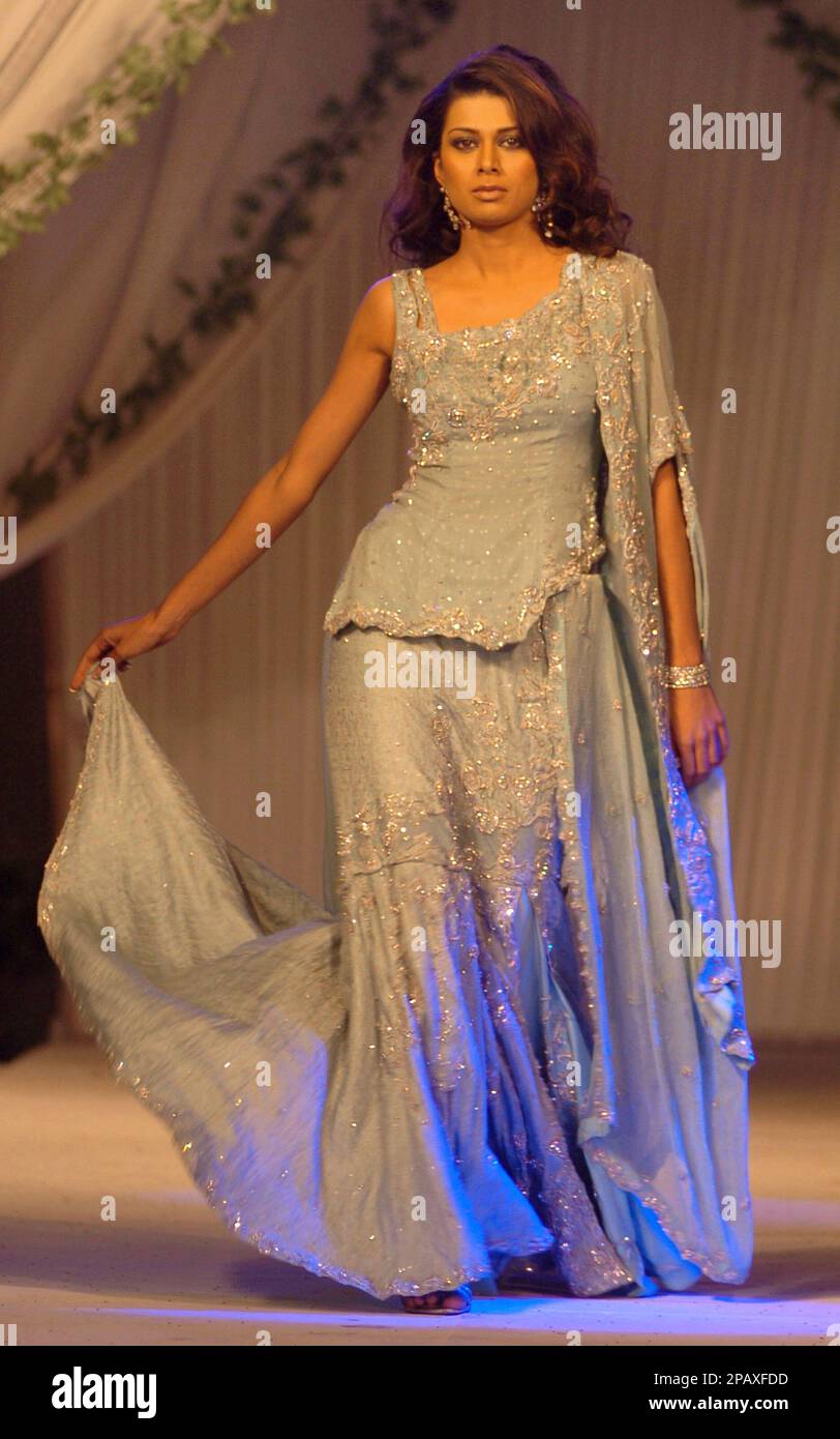 A Pakistani model displays a creation by local designer Faiza Sami at a ...