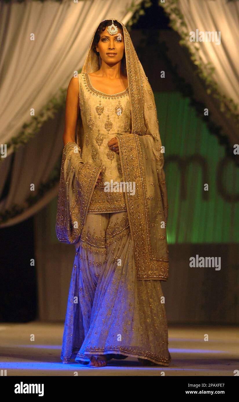 A Pakistani model displays a creation by local designer Faiza Sami at a ...