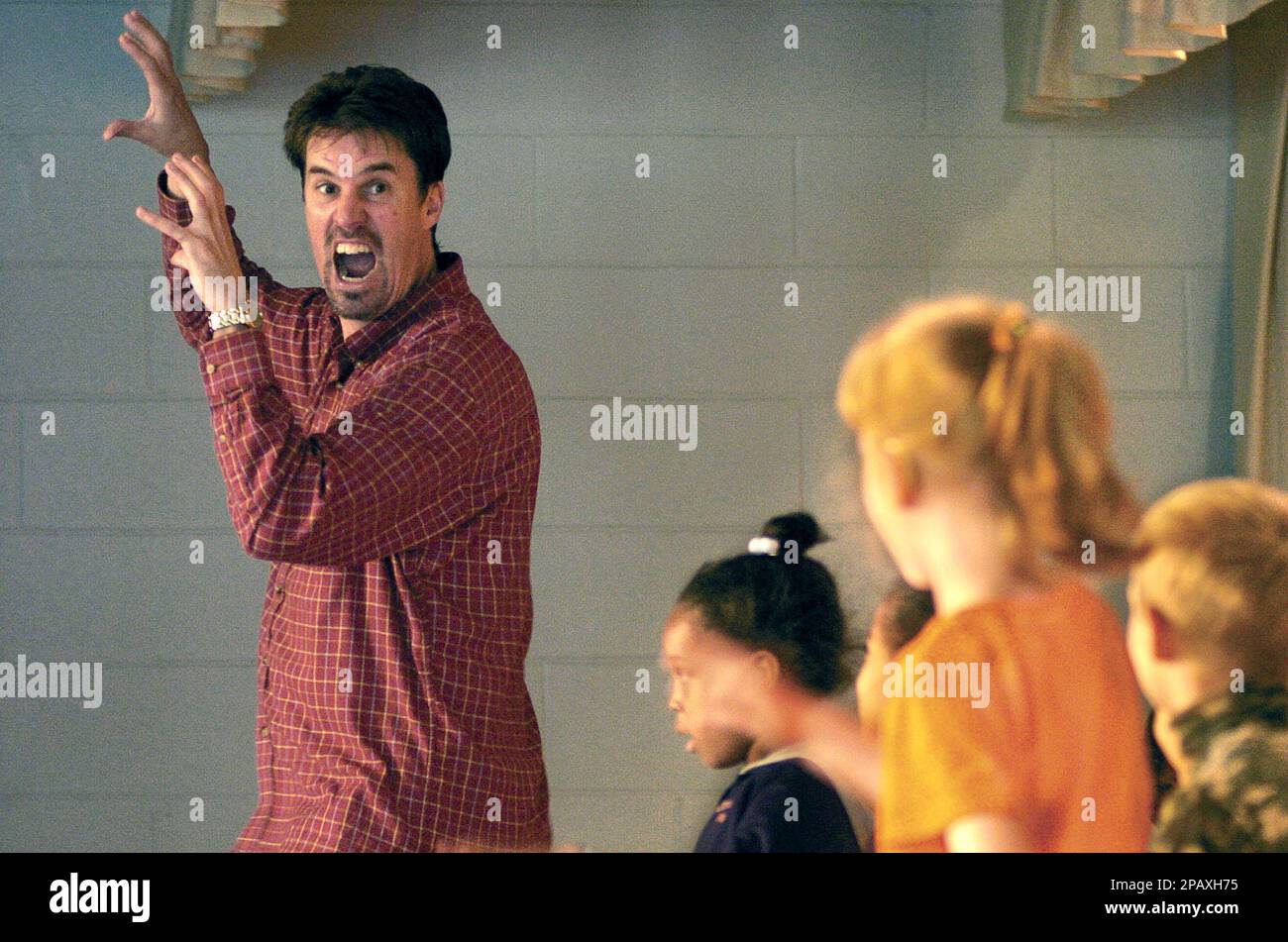 Beaufort Elementary School music teacher Jordan Culver encourages his ...