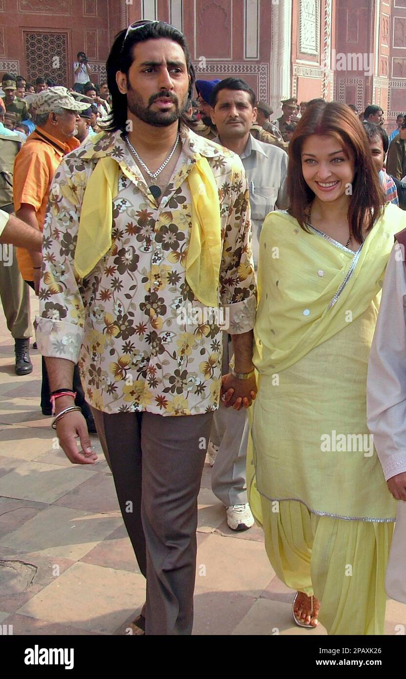 Bollywood couple Abhishek Bachchan, left and Aishwarya Rai walk near ...