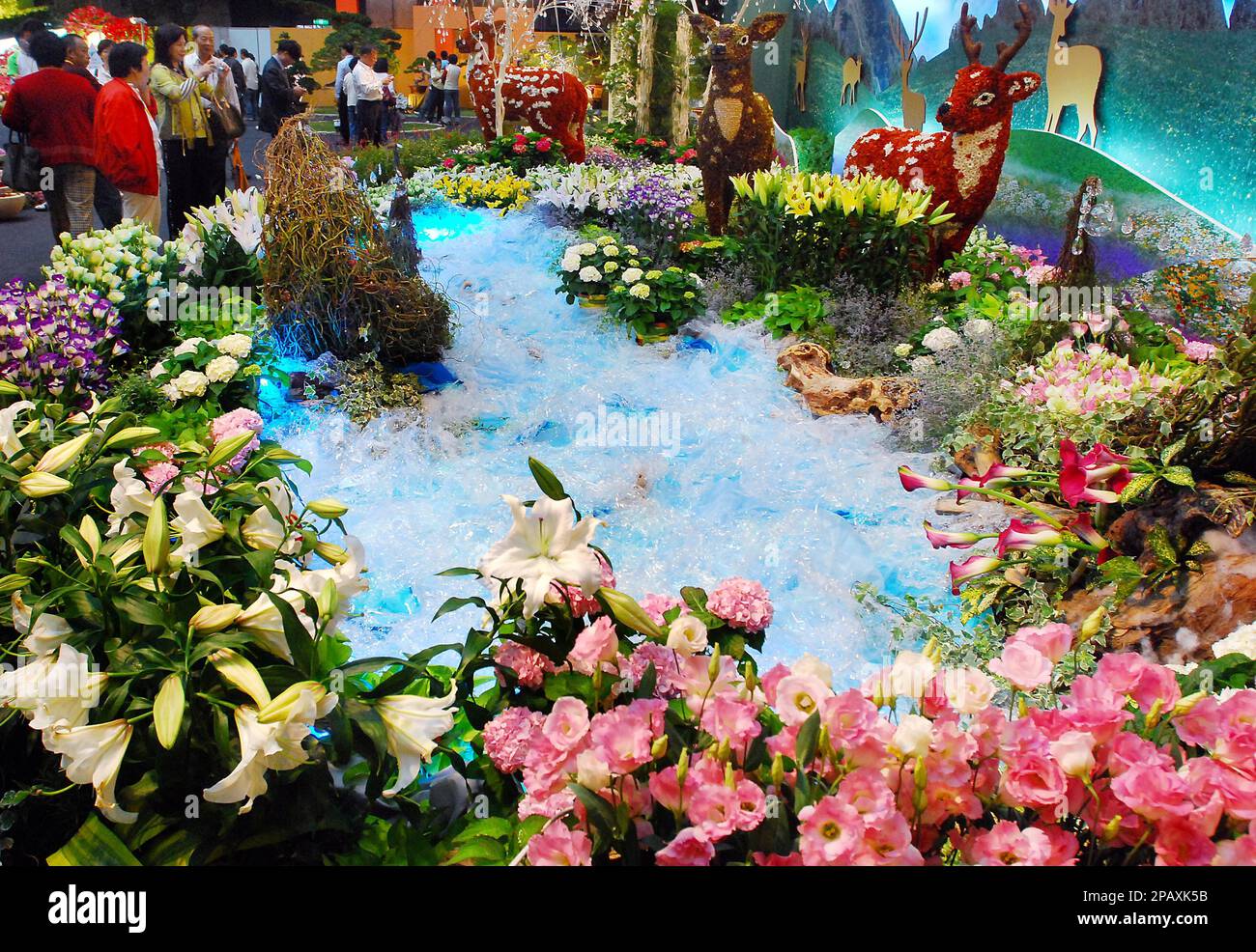 Visitors view an array of plants at the Taipei International Flower ...